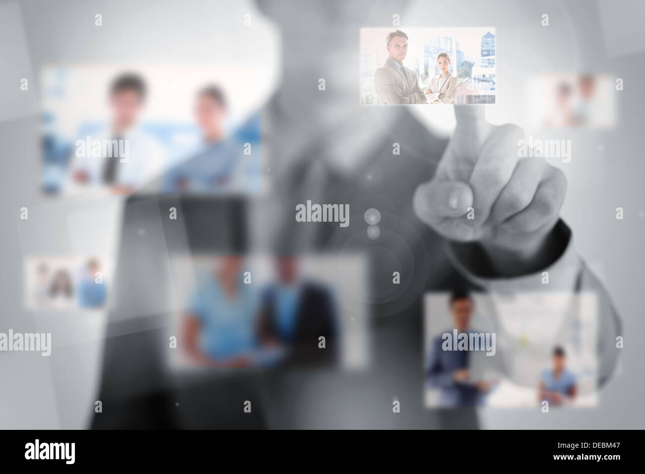 Businessman choosing a picture Stock Photo - Alamy