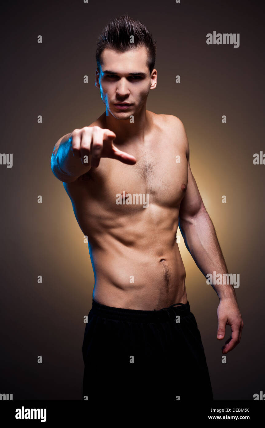 Portrait of a confident looking very lean fit young male athlete Stock ...