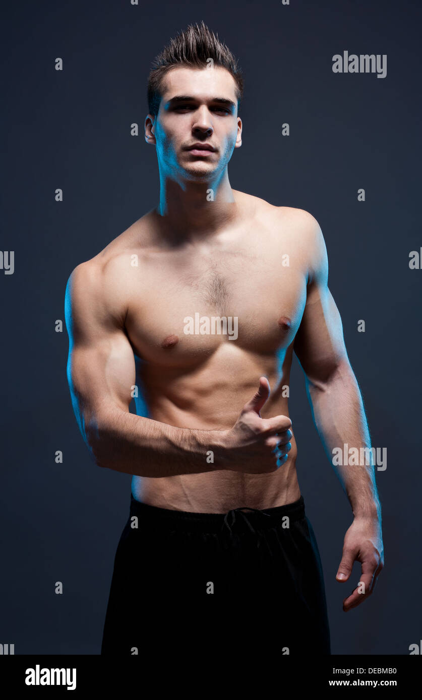 Portrait of a confident looking very lean fit young male athlete Stock ...