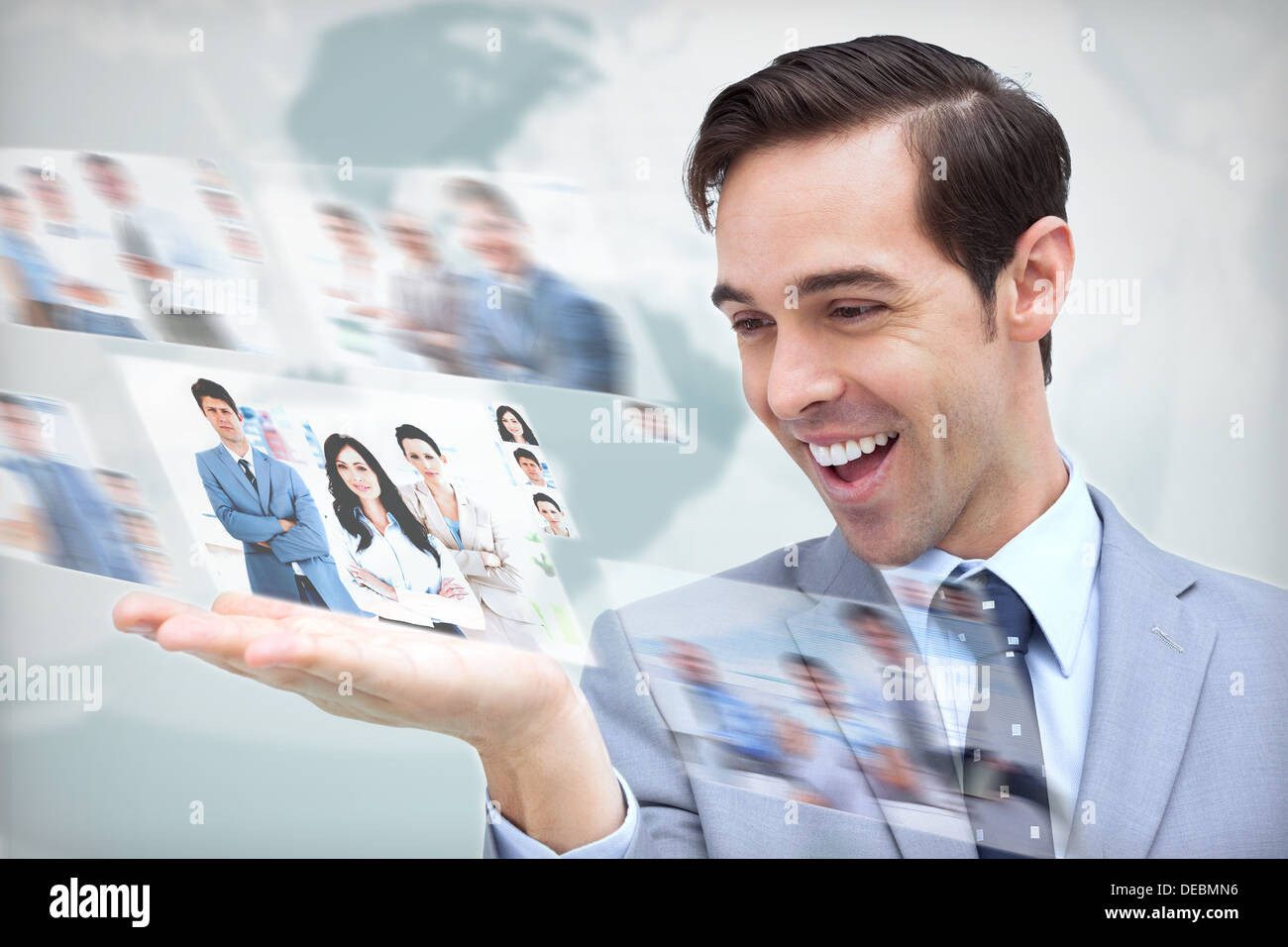 Happy businessman presenting pictures Stock Photo - Alamy