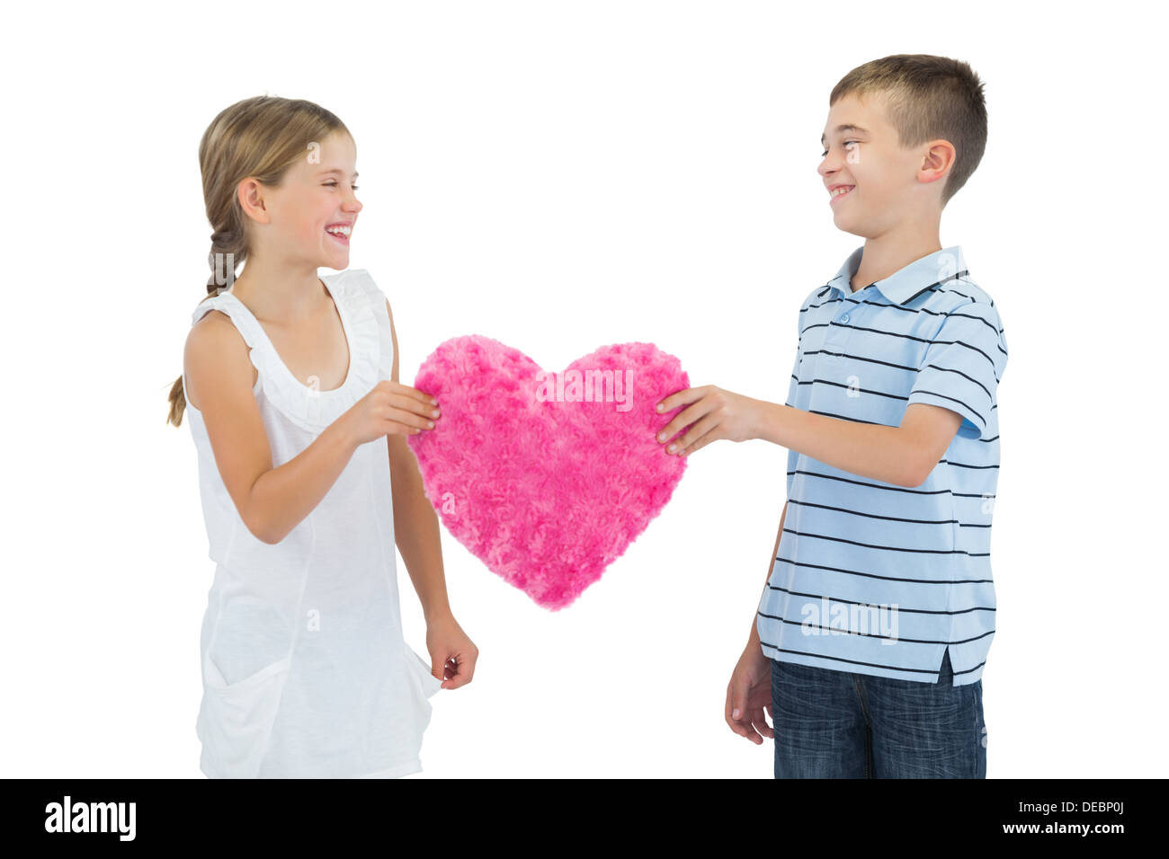 Smiling children holding heart soft hi-res stock photography and images ...