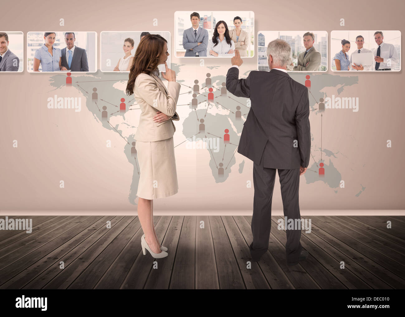 Business people selecting digital interface together Stock Photo - Alamy