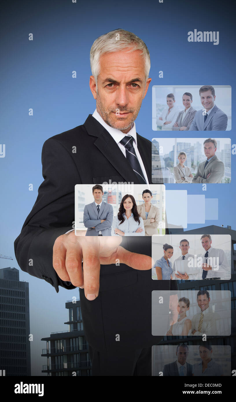 Experienced classy businessman using digital interface Stock Photo - Alamy