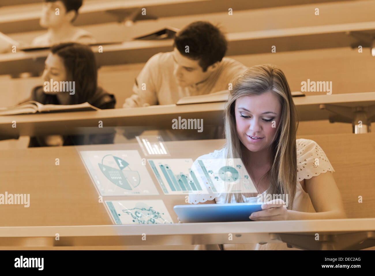 Pretty blonde student analysing graphs on her digital tablet Stock ...
