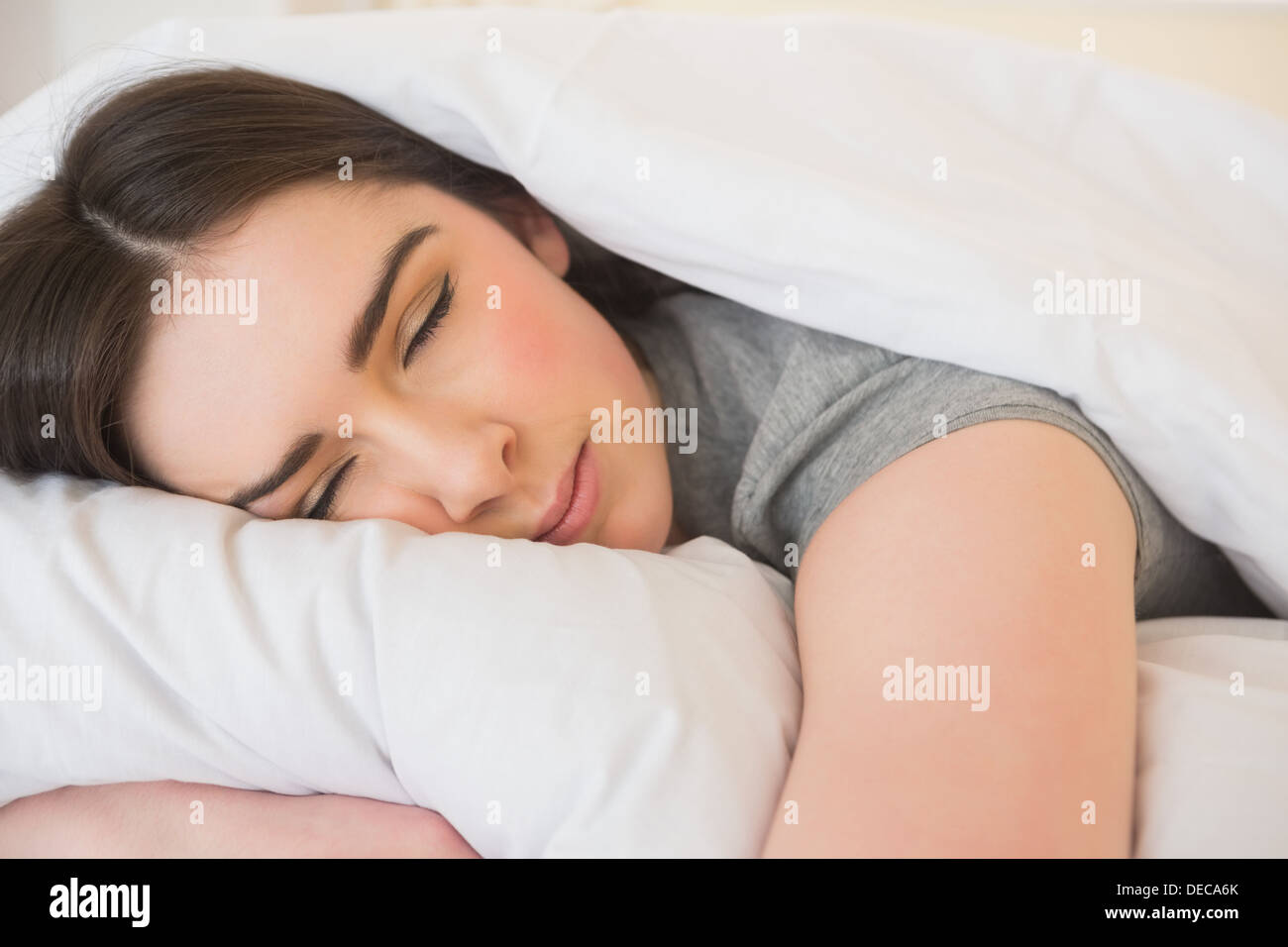 Calm girl sleeping in her bed Stock Photo - Alamy