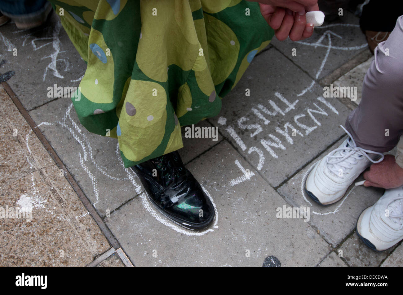Protesters leave chalk footprints outside the Shell HQ building to ...