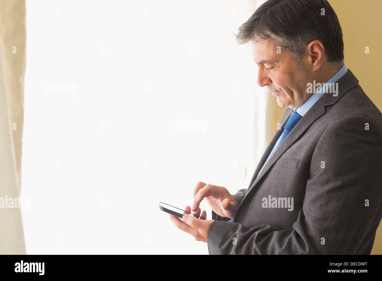Thoughtful man typing message on hi-res stock photography and images ...