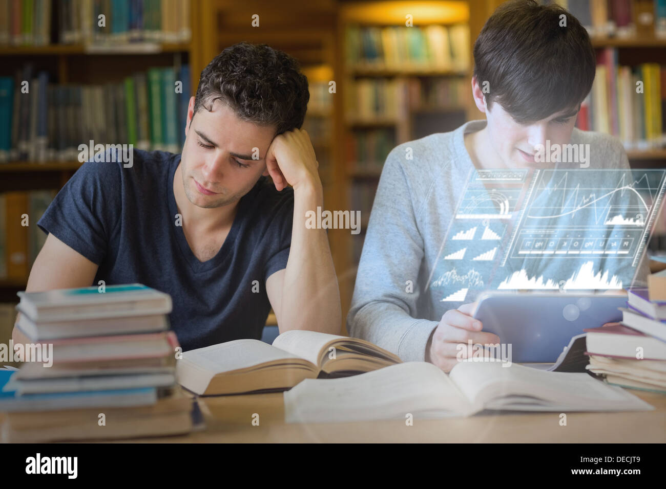 Focused students working together with futuristic interface Stock Photo ...