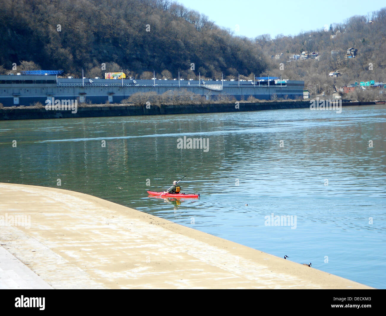 A canoeist is paddling on the Allegheny River in Pittsburgh ...