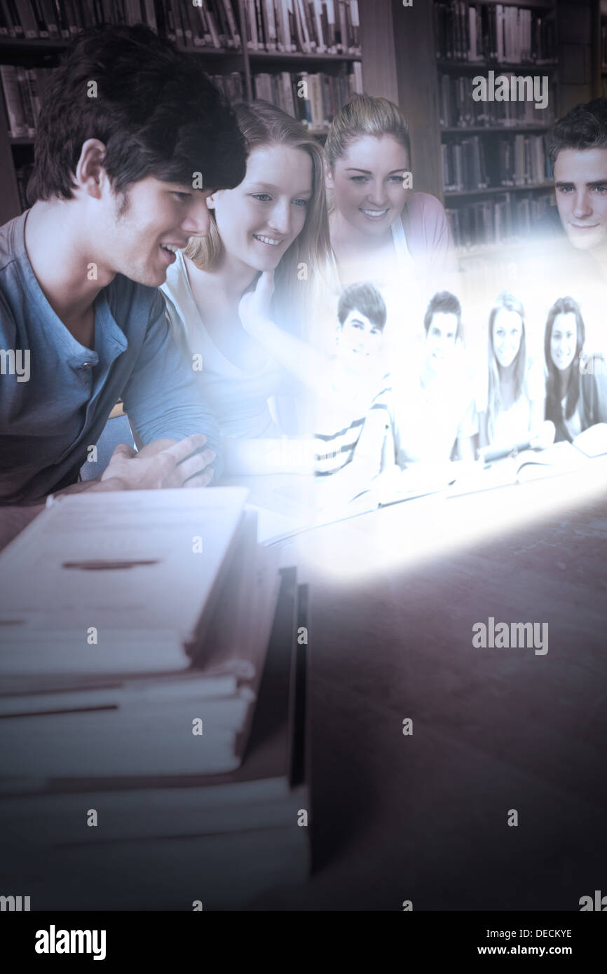 Cheerful college friends watching photos hi-res stock photography and ...