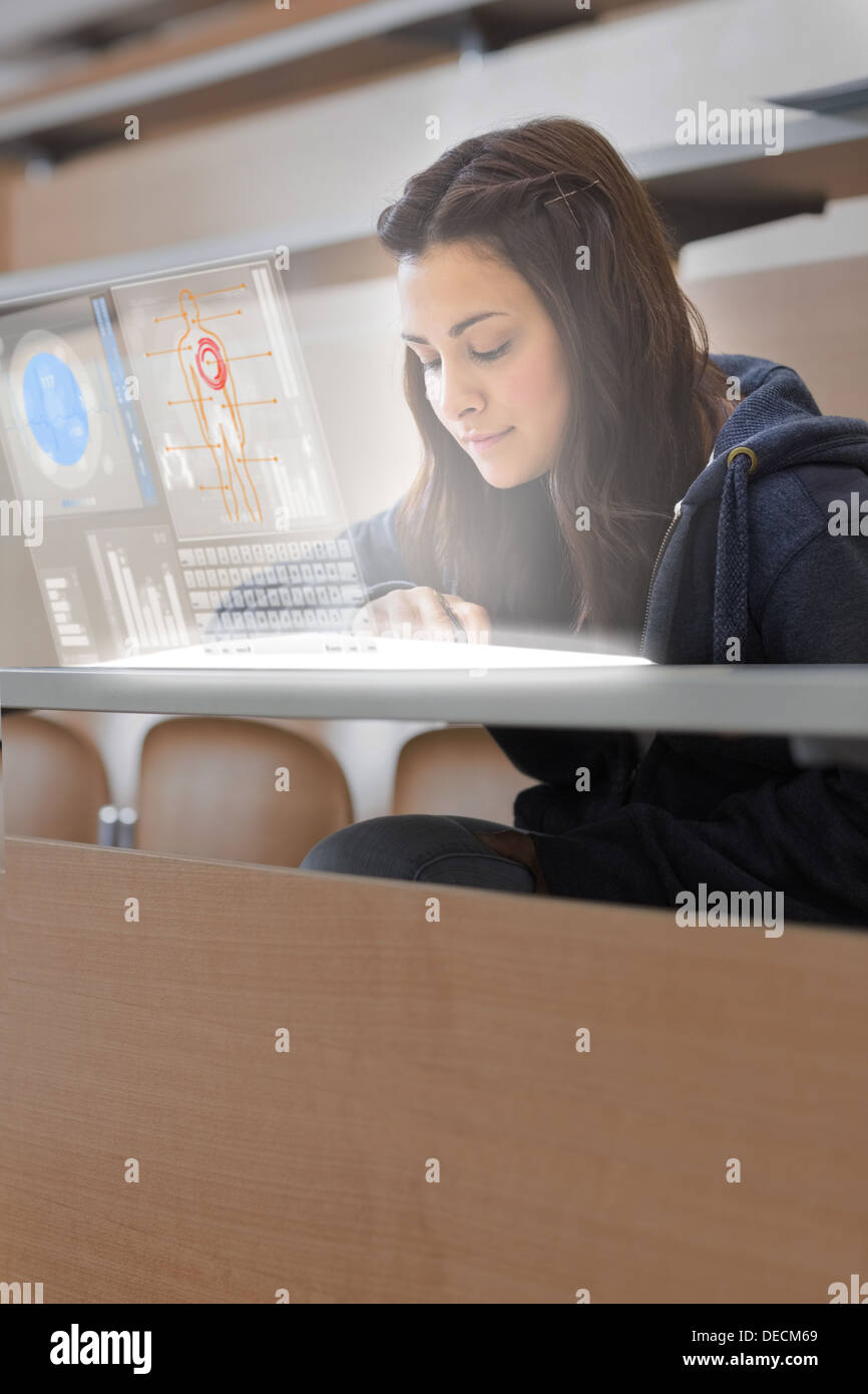 Concentrated college student working on her digital laptop Stock Photo ...