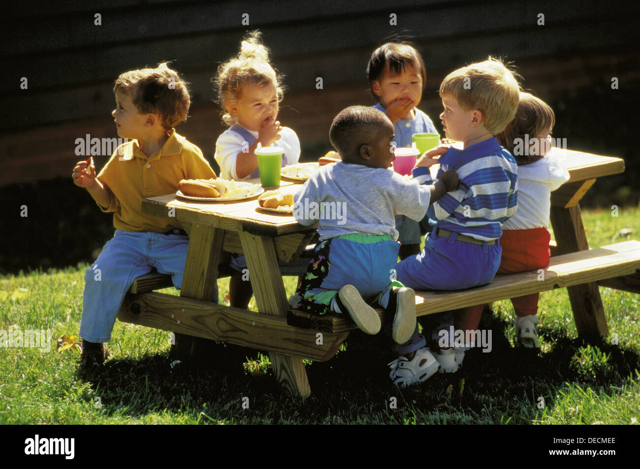3 Friends Sitting Around Table High Resolution Stock Photography and ...