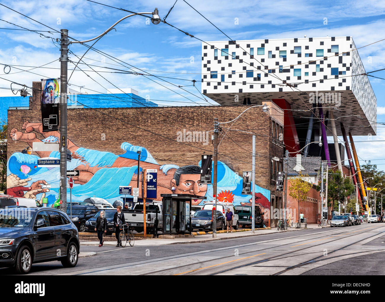 Street art next to parking lot next to modernist OCAD building. Giant ...