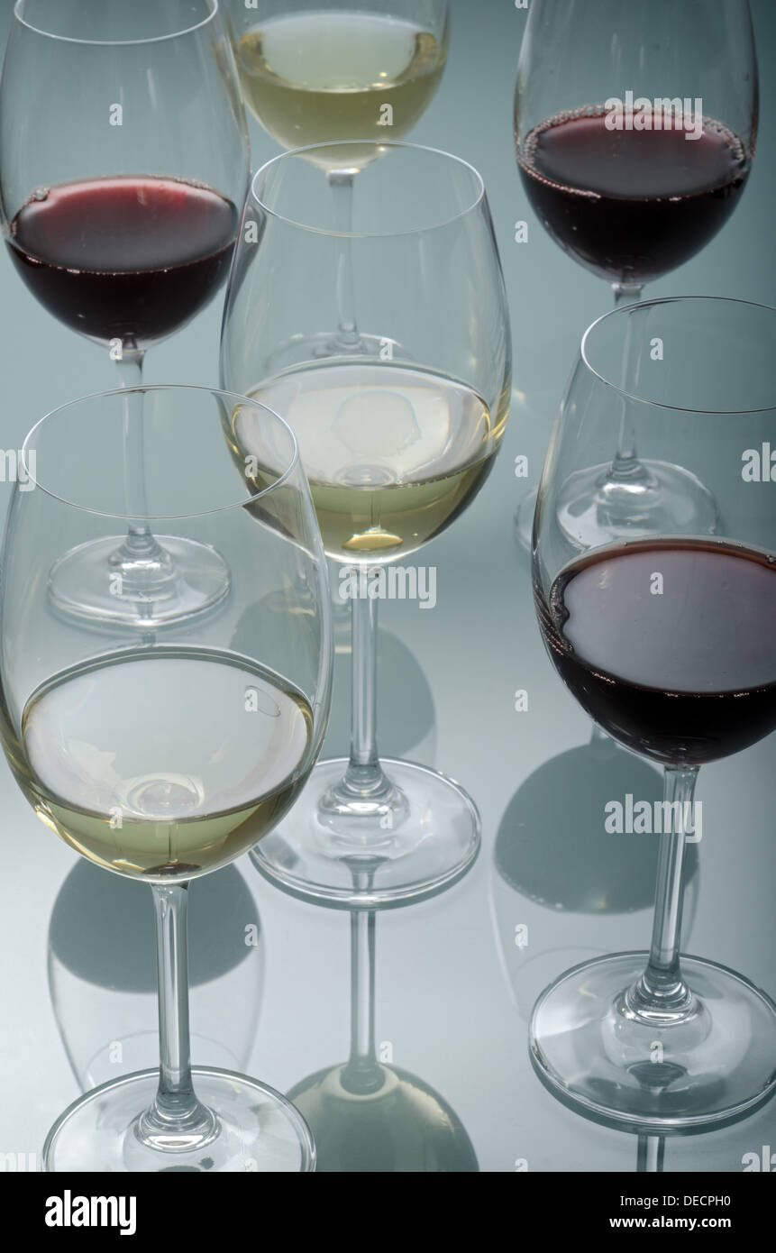 glasses of red and white wine on glass table Stock Photo - Alamy