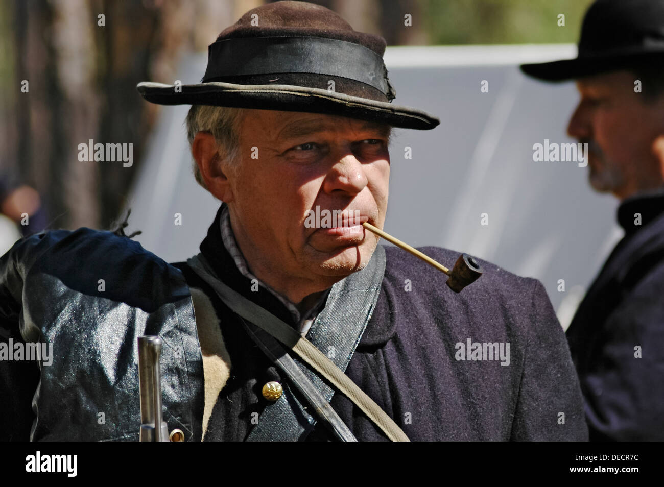 Confederate soldiers smoking a pipe at an encampment during an American ...