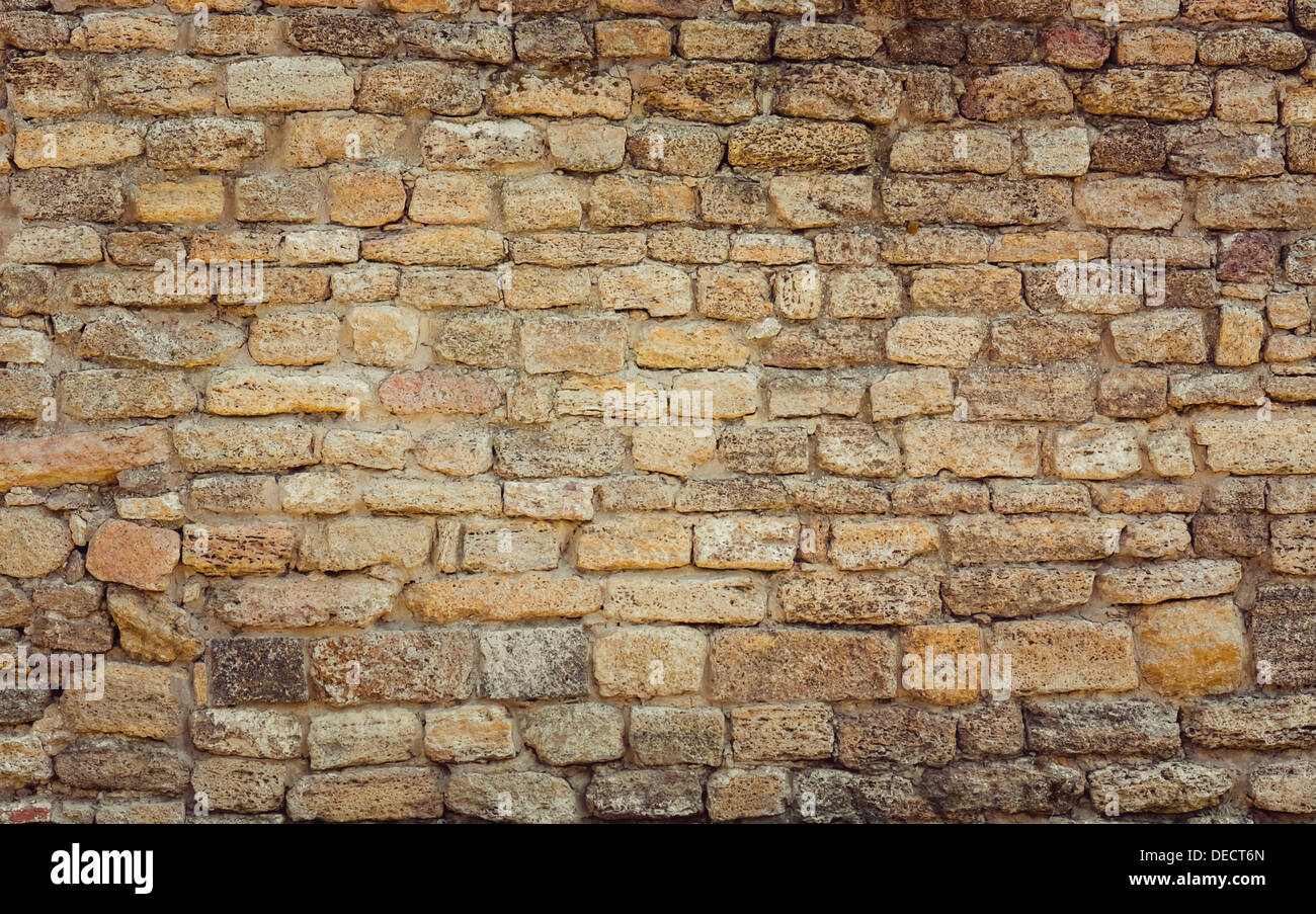 Old wall made of the Jerusalem stone. Wall constructed of stone bricks ...