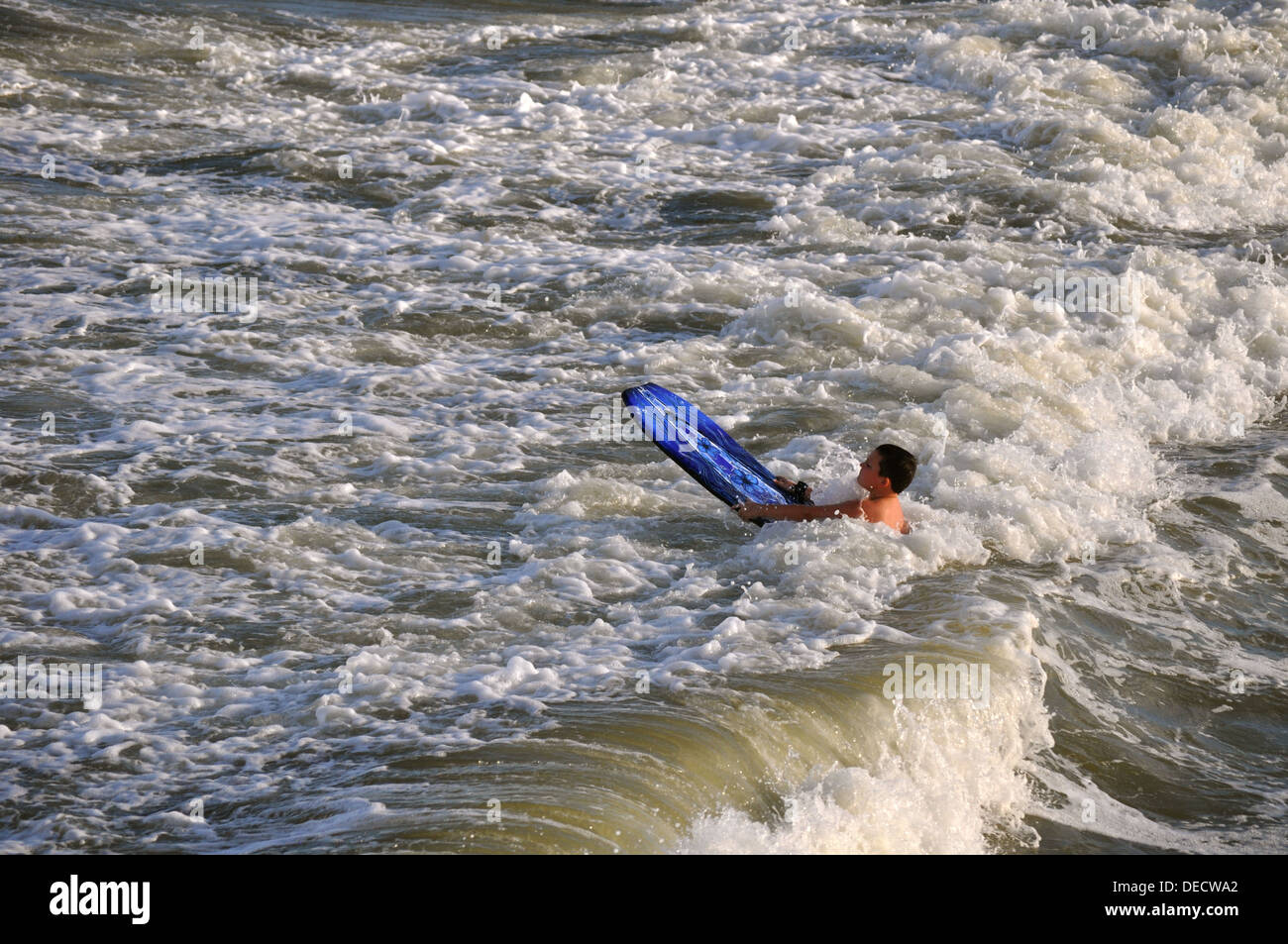 Boy in Waves Stock Photo - Alamy