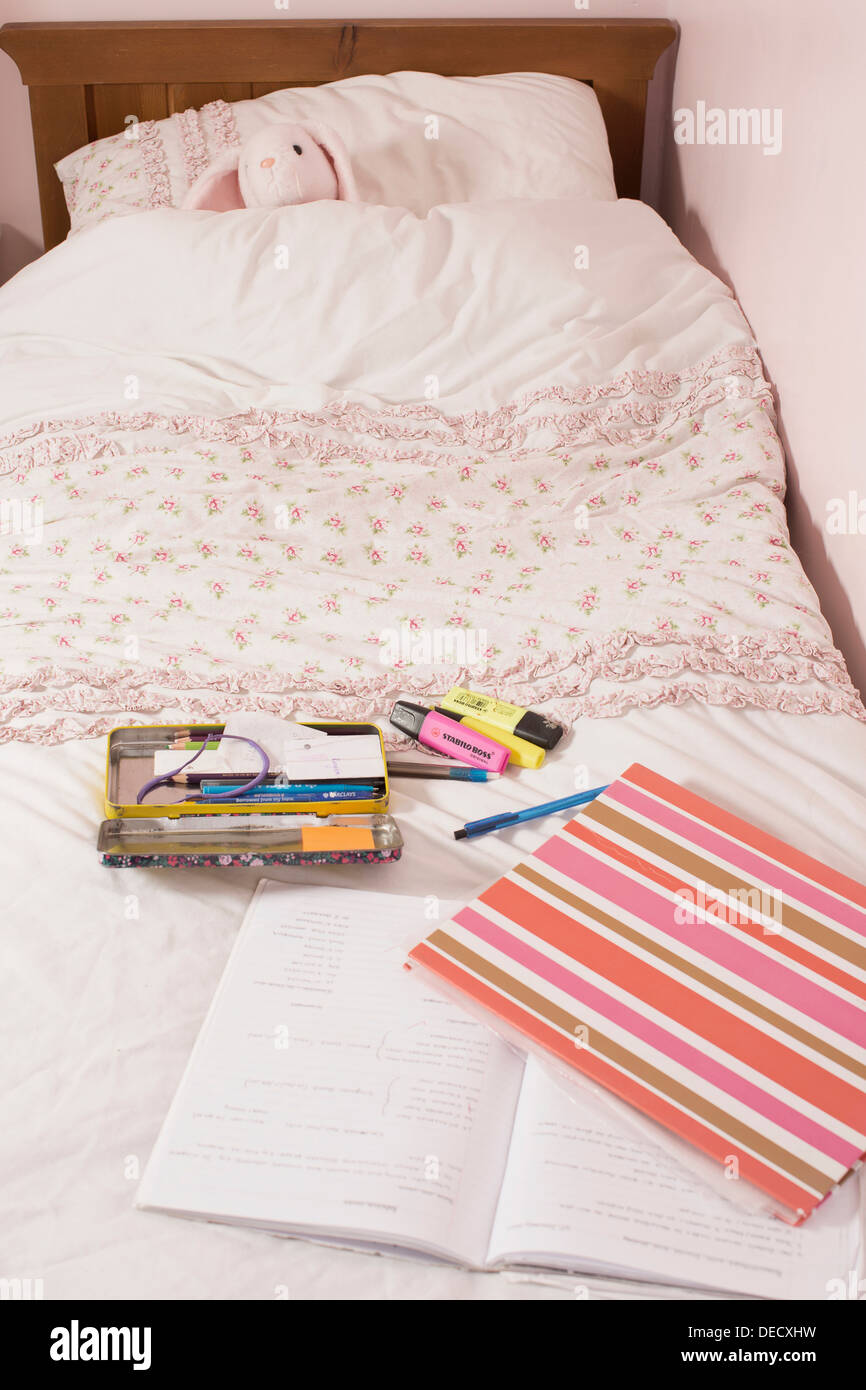 Homework on bed hi-res stock photography and images - Alamy