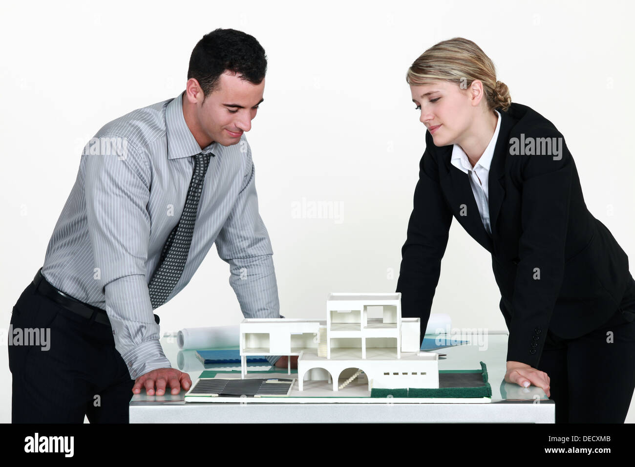 Architects looking at a 3D model Stock Photo - Alamy