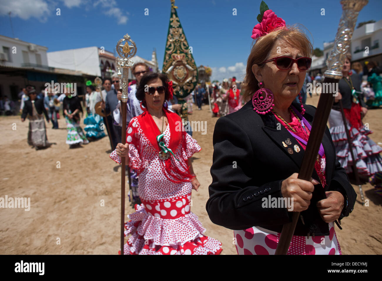 Female pilgrims holding staffs during the pilgrimage to the shrine of ...