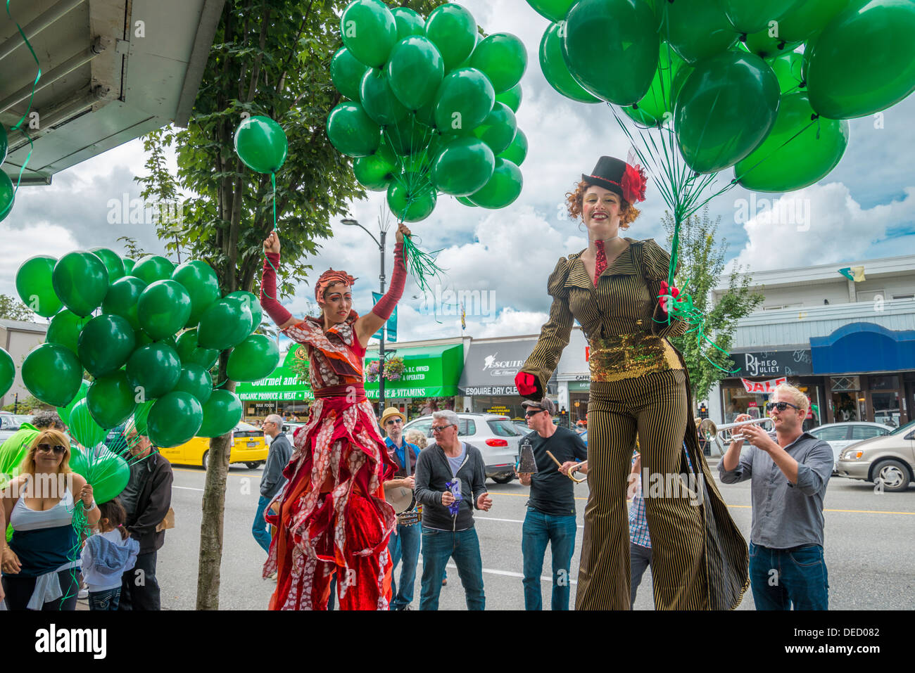 Stilt performers and the Paperboys band at Cambie Village Summer ...