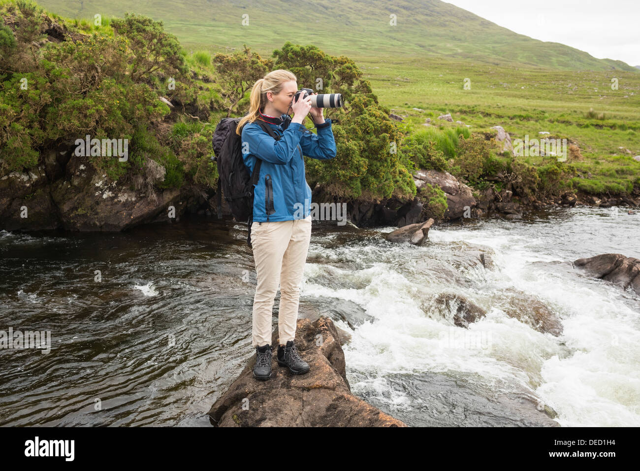Woman standing in the rain hi-res stock photography and images - Alamy
