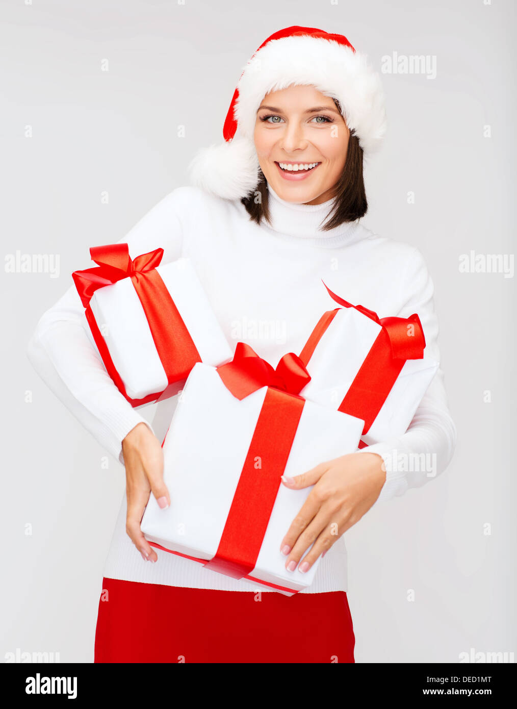 woman in santa helper hat with many gift boxes Stock Photo - Alamy
