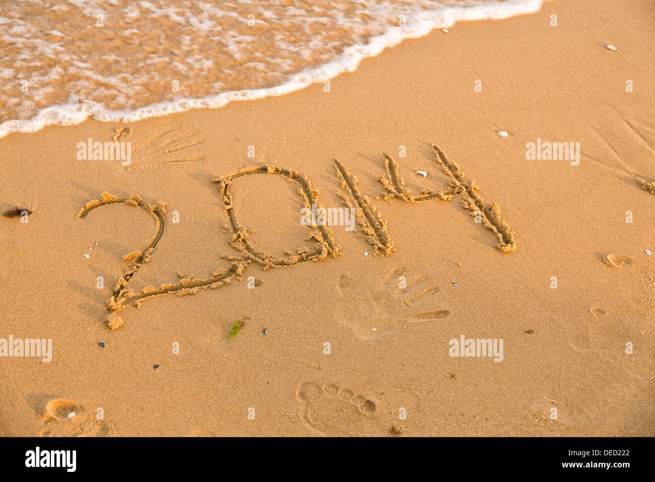 2014 numbers on the yellow sandy beach hi-res stock photography and ...