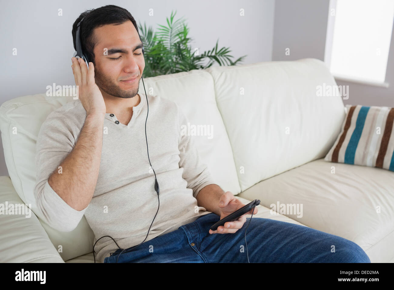 Handsome man listening music hi-res stock photography and images - Alamy