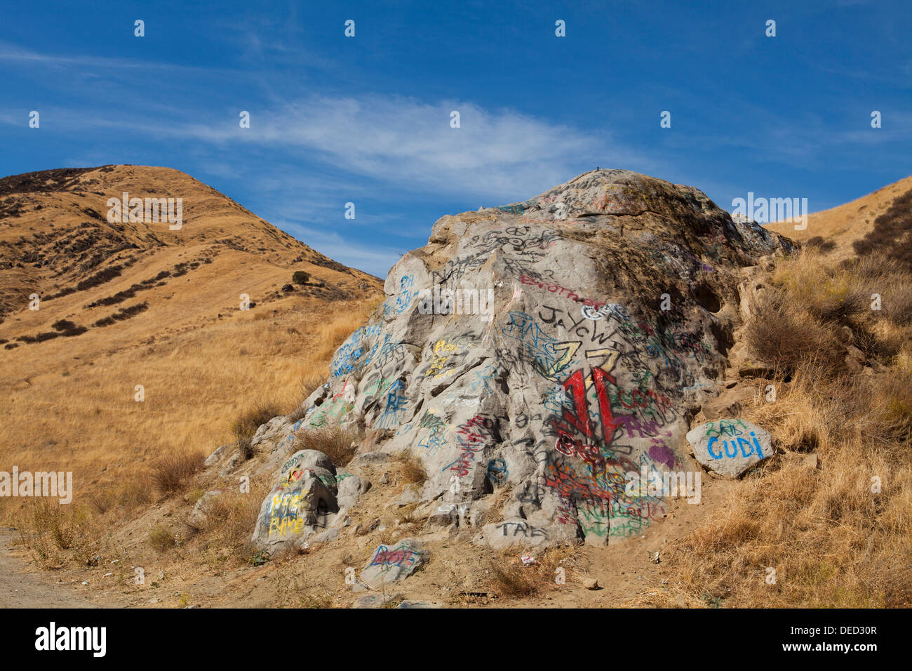 Desert boulder vandalized with graffiti - California, USA Stock Photo ...