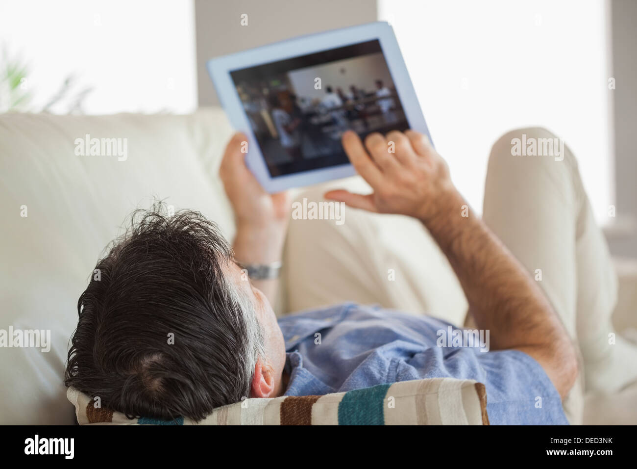 Laying on the sofa hi-res stock photography and images - Alamy