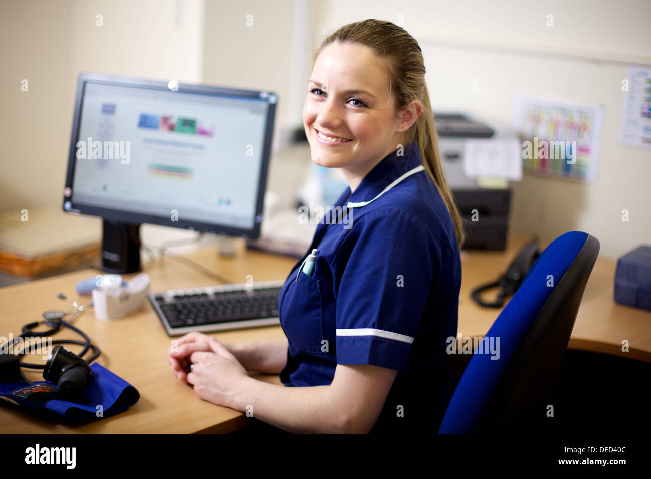 portrait of nurse at office desk Stock Photo - Alamy