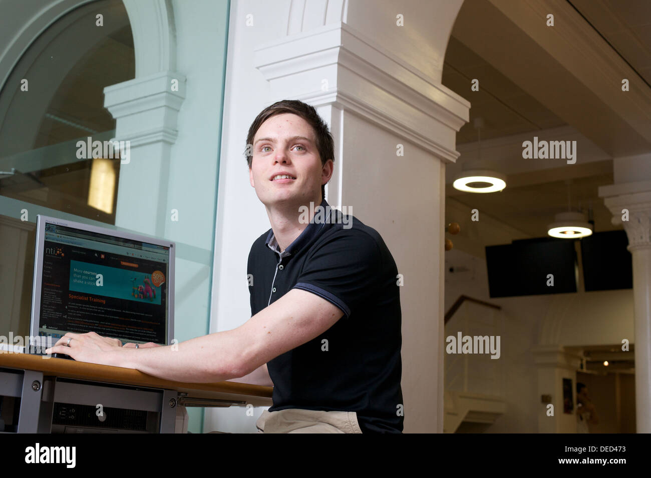 young man on computer Stock Photo - Alamy