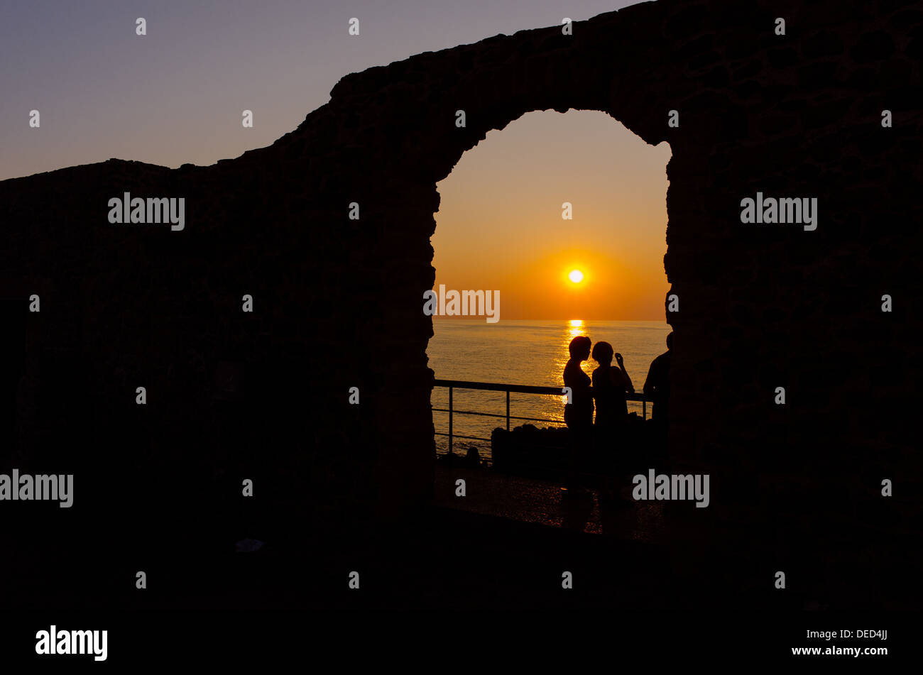 Tourists enjoy the Sicilian sunset at Cefalù Stock Photo - Alamy