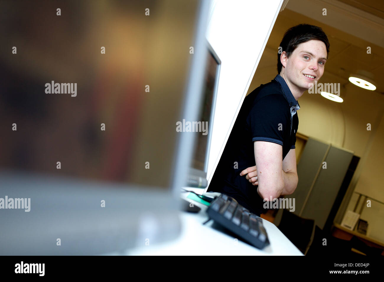 young man on computer Stock Photo - Alamy
