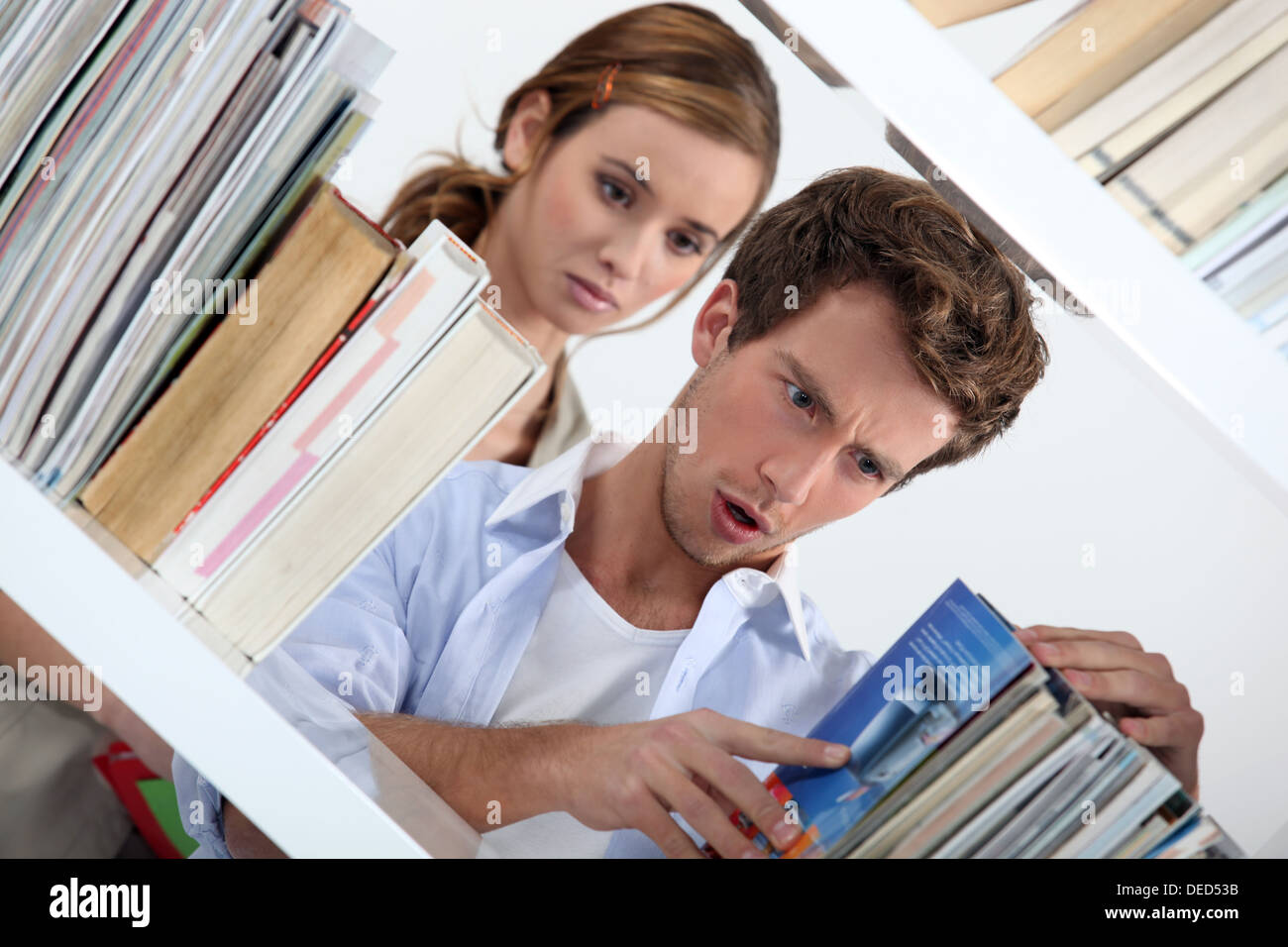 Student shocked looking books hi-res stock photography and images - Alamy