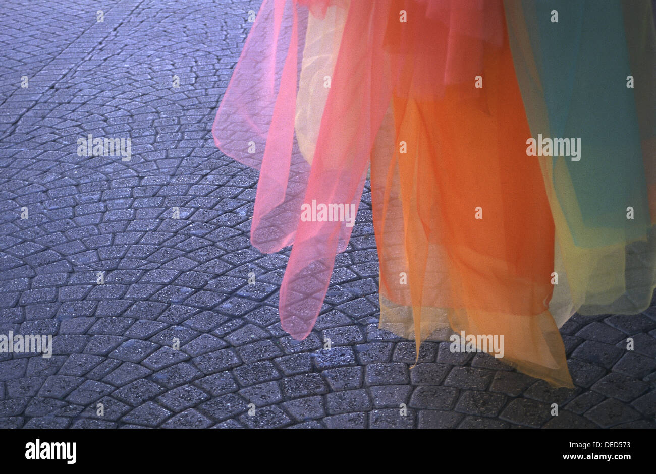 Coloured handkerchief hanging over cobbled stone pavement in Nahalat ...