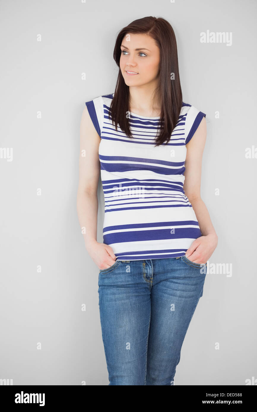 Stylish girl standing and looking away Stock Photo - Alamy