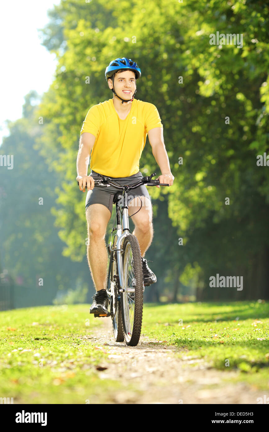 Man ride cycle in park hi-res stock photography and images - Alamy