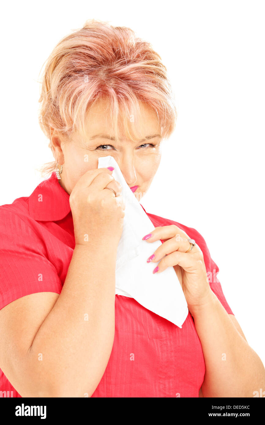 Sad mature woman wiping her eye from crying with tissue Stock Photo - Alamy