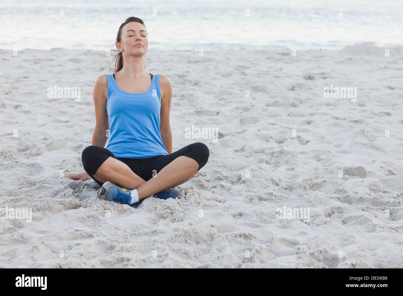 Woman sitting in beach hi-res stock photography and images - Alamy