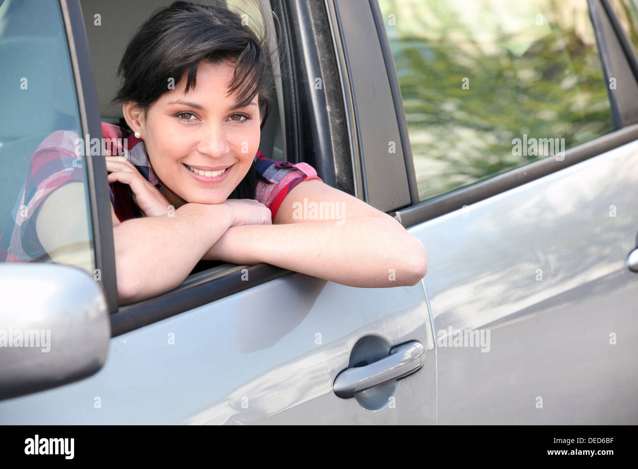 Happy female driver Stock Photo - Alamy