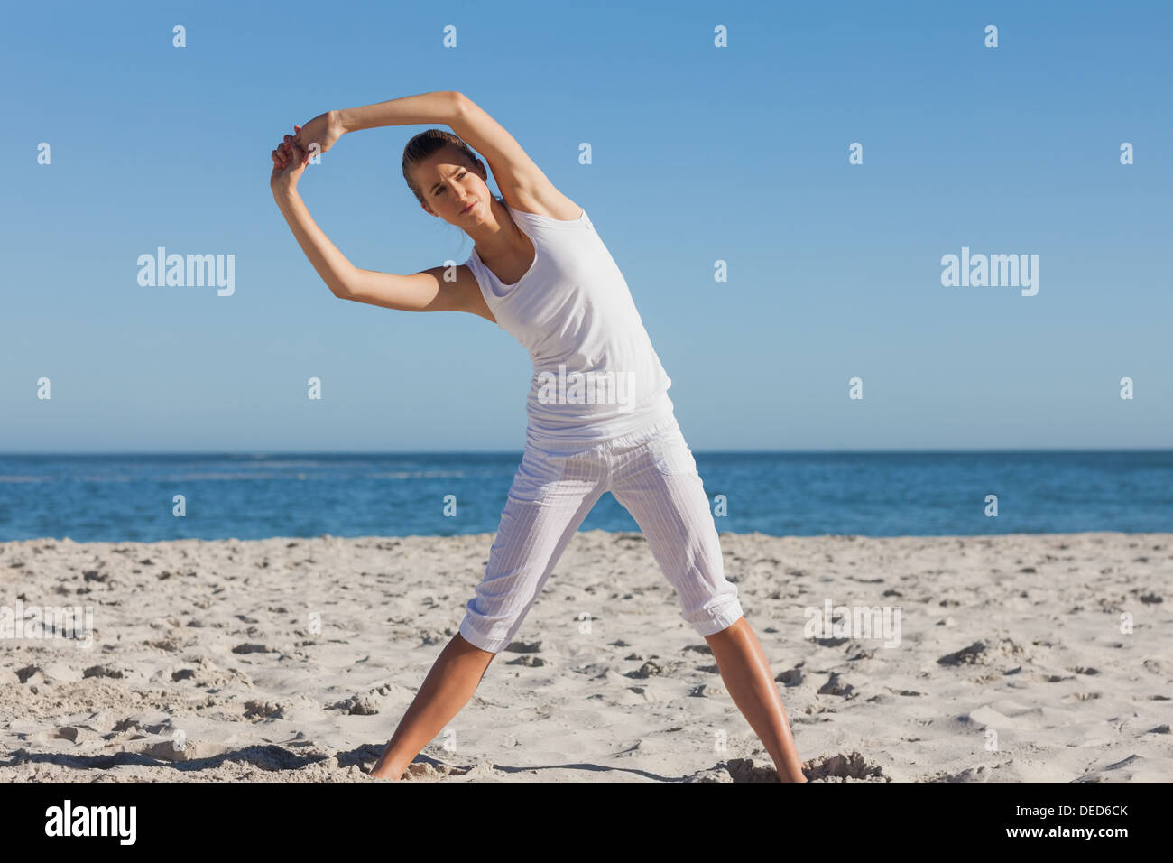 Woman stretching in yoga pose Stock Photo - Alamy