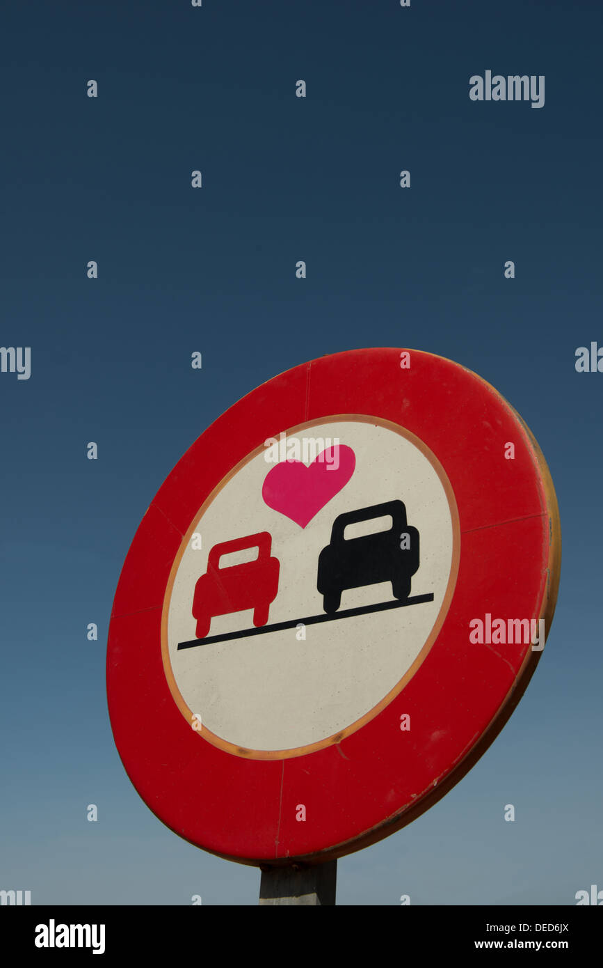 A road sign with two cars and a love heart Stock Photo - Alamy