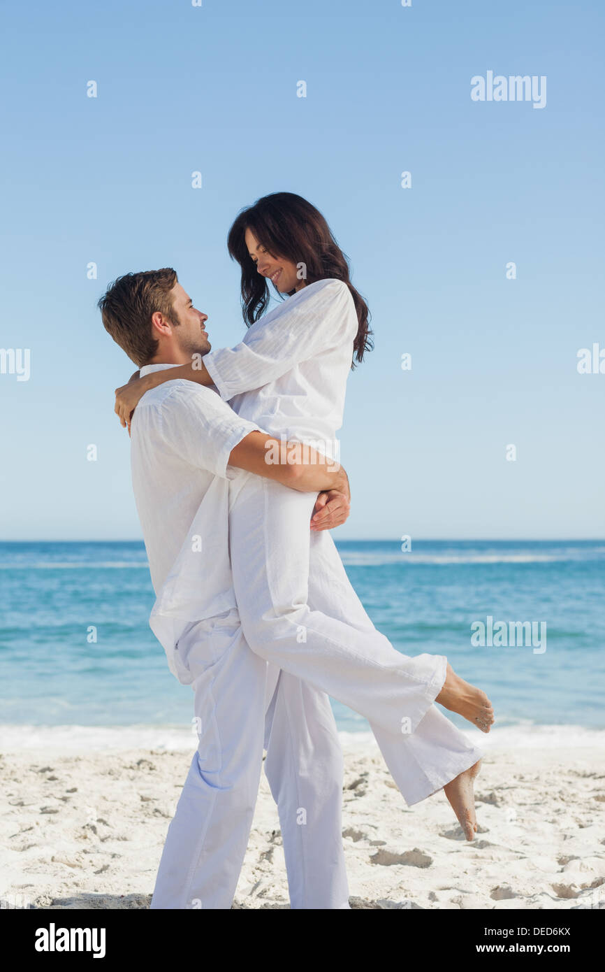 Guy Carrying Girl In Arms Romantic