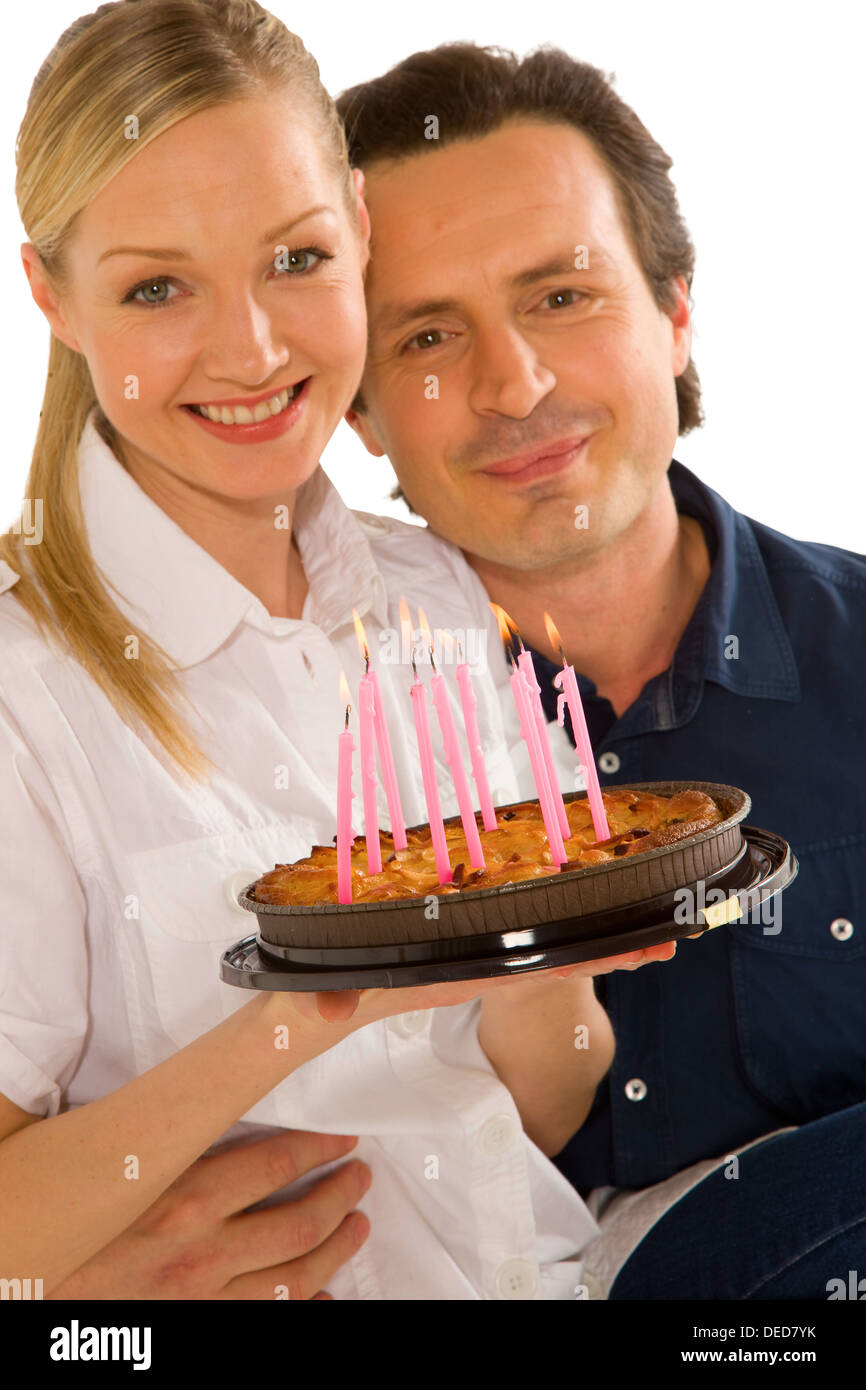 couple celebrating birthday with cake Stock Photo - Alamy