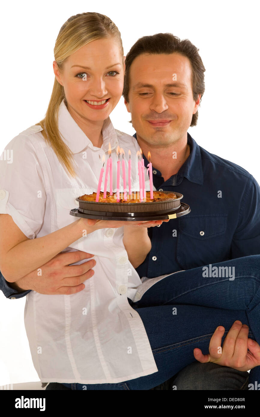 couple celebrating birthday with cake Stock Photo - Alamy