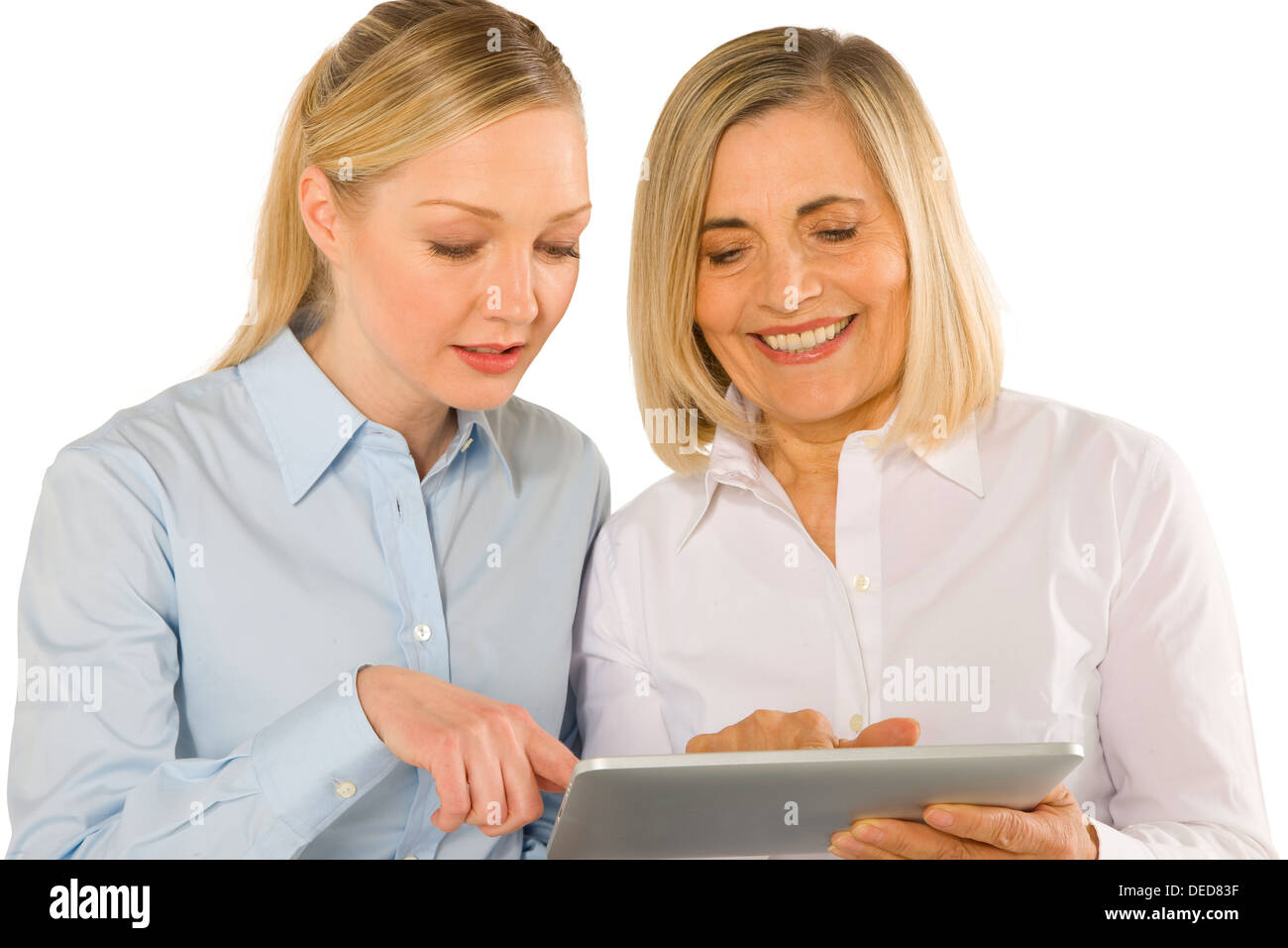 two women using tablet Stock Photo - Alamy