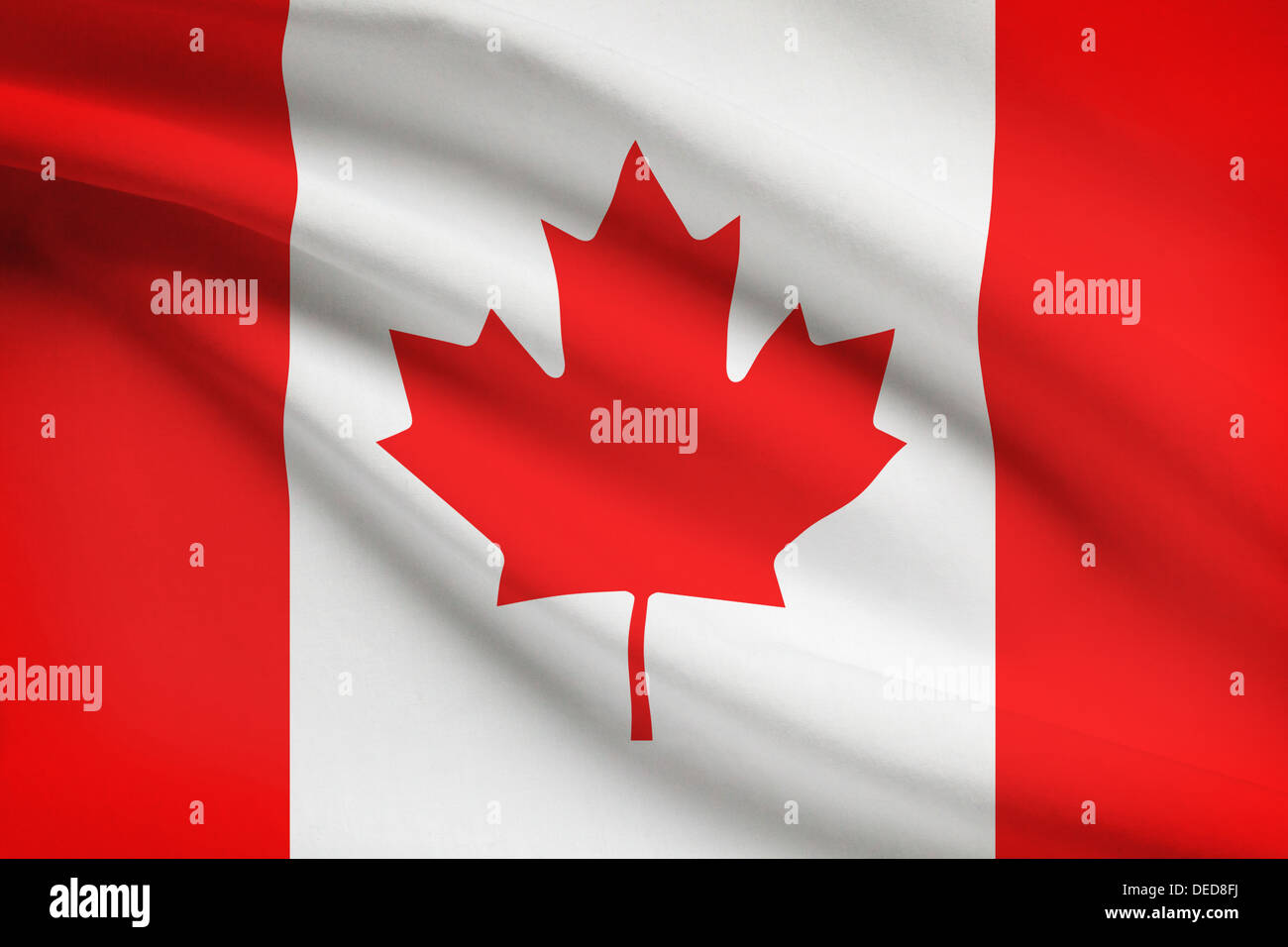 Canadian flag blowing in the wind. Part of a series Stock Photo - Alamy