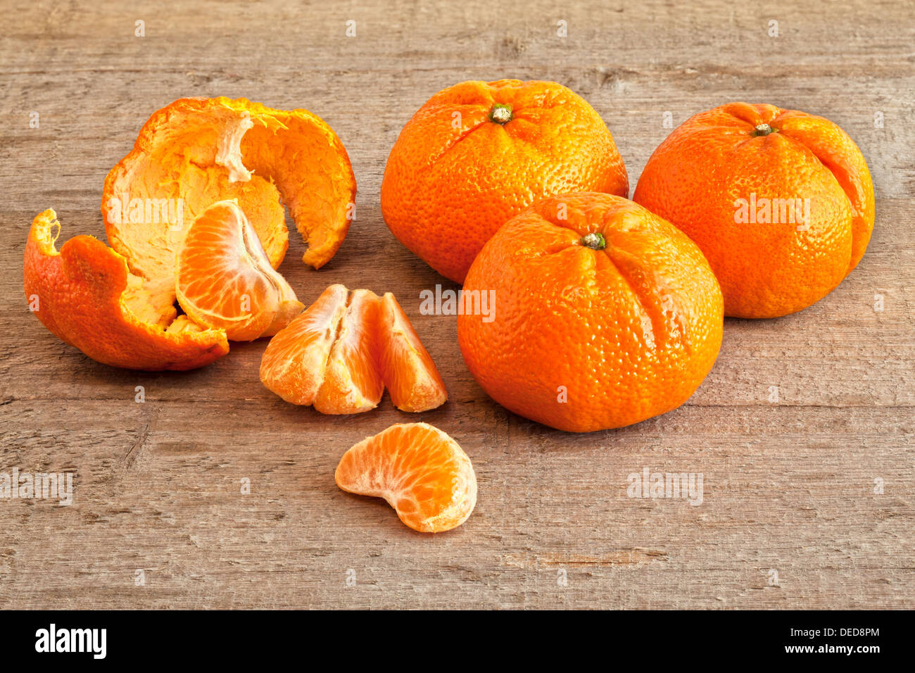 Mandarin Oranges - mandarin oranges on a rustic wooden surface, three ...